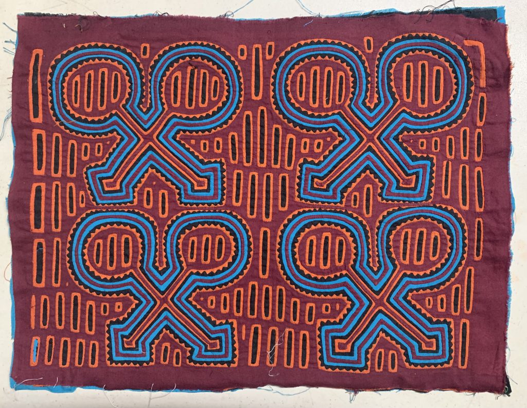 Naa (rattle) mola - The Art of Mola